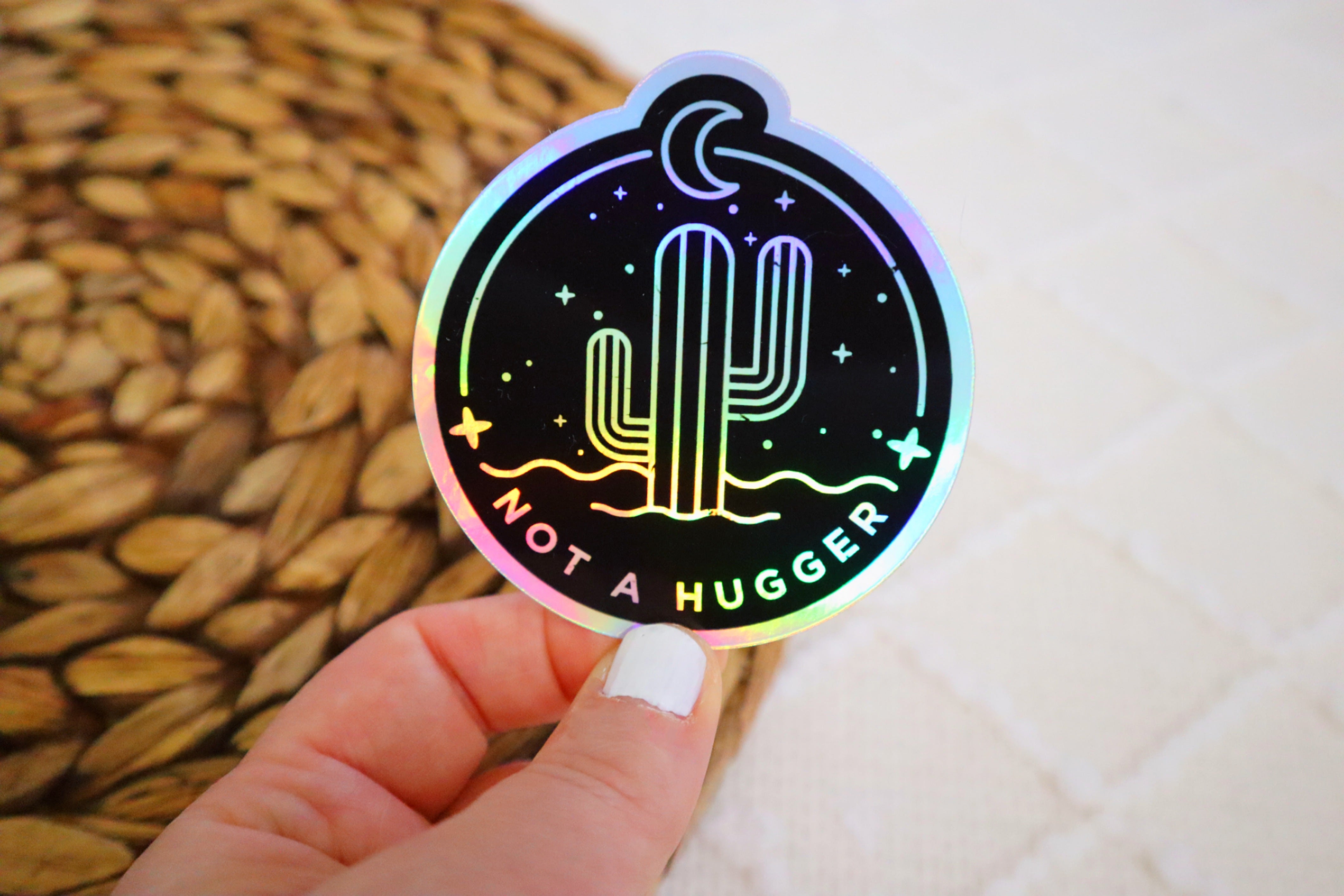 Holographic Not A Hugger Sticker – AceThePitmatianCo
